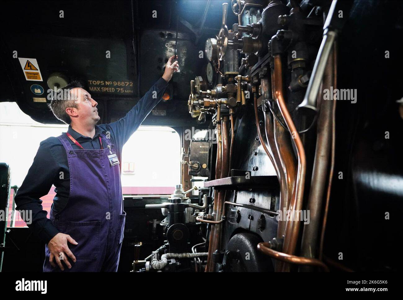 Volunteer train crew member Ian, aboard The Flying Scotsman on Platform 8 at King's Cross ...