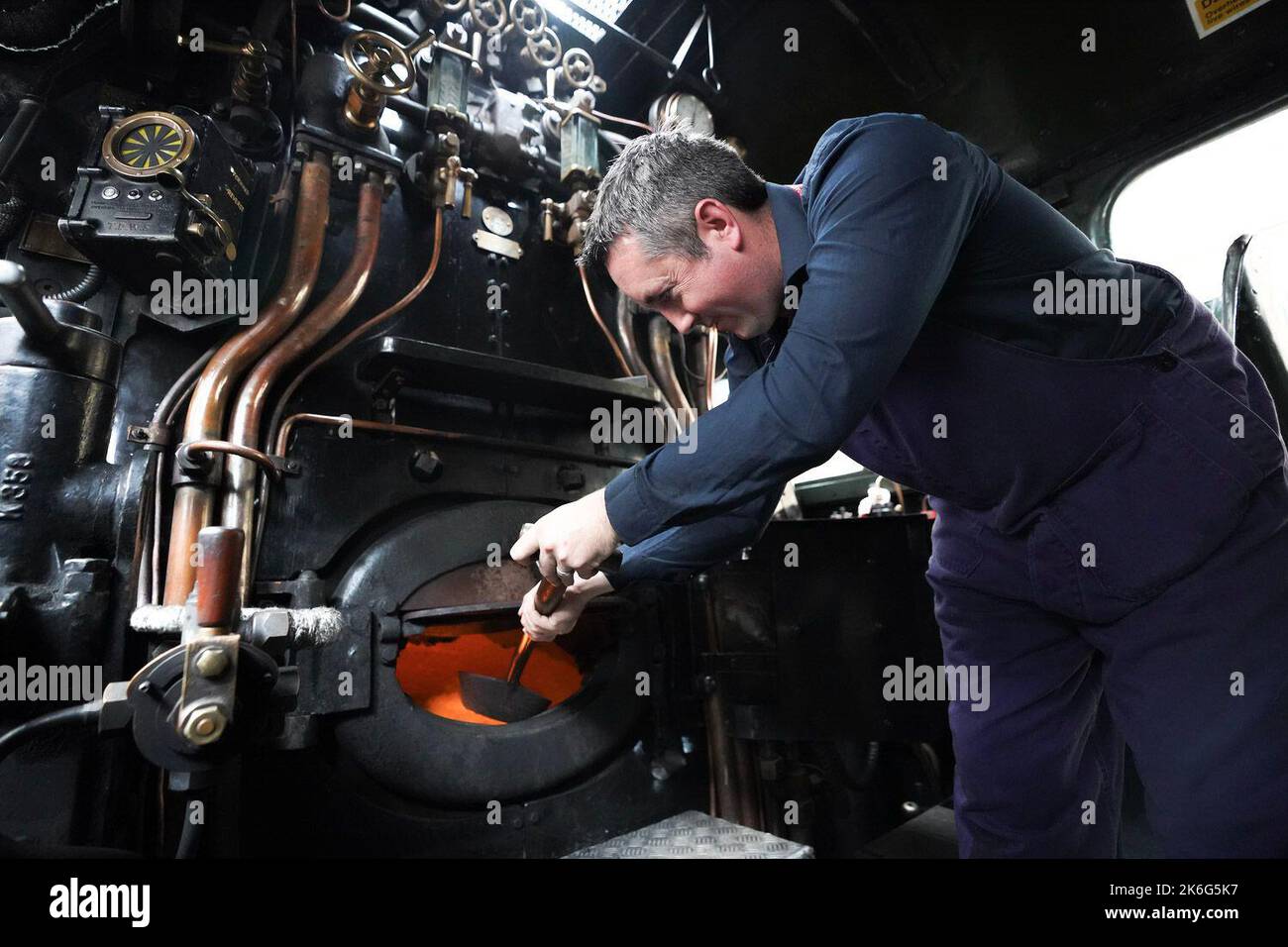 Volunteer train crew member Ian, aboard The Flying Scotsman on Platform 8 at King's Cross ...