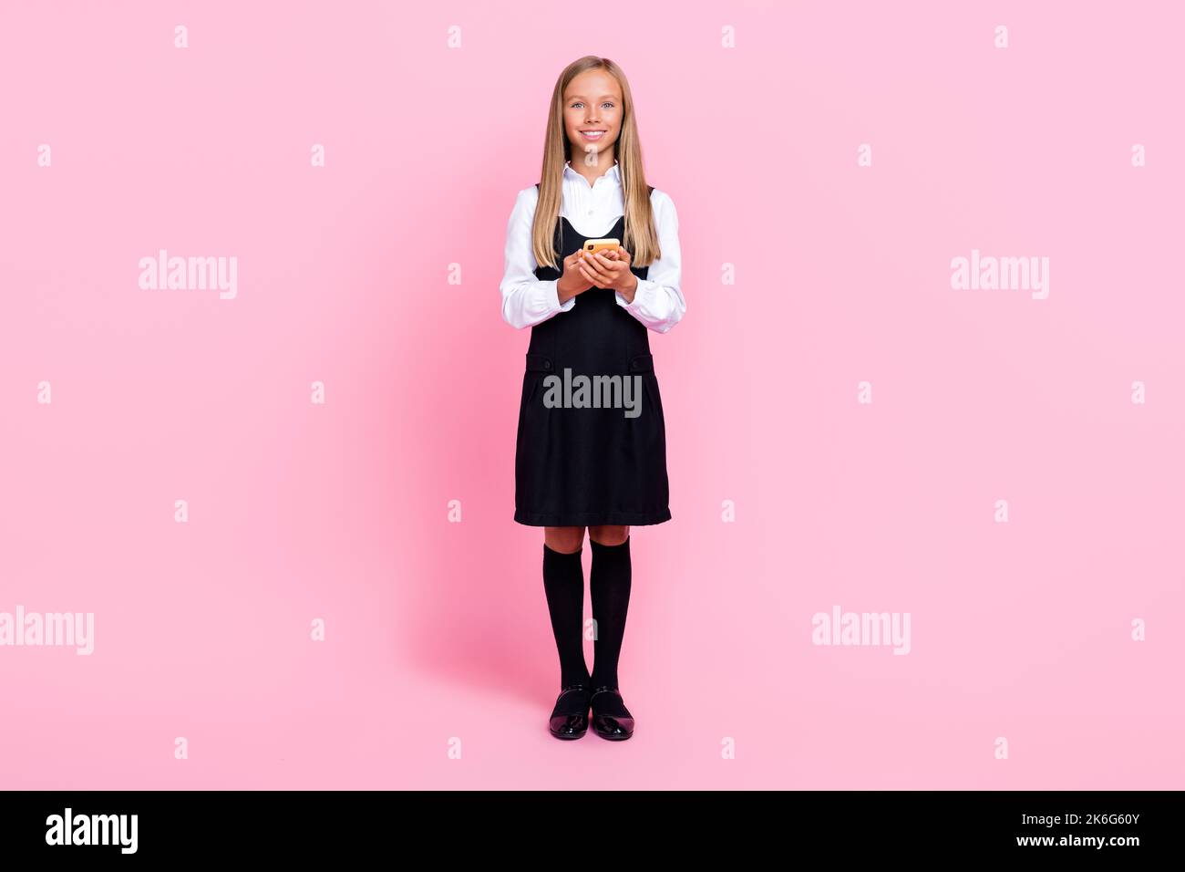 Full body size photo of young cute schoolkid girl hold new gadget for ...