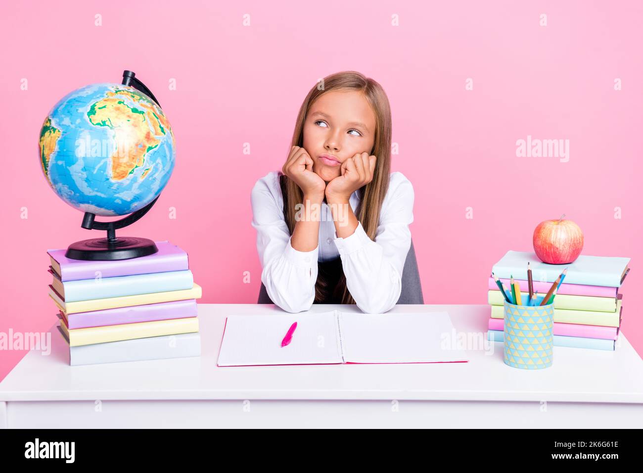 Photo of young funny pretty cute schoolkid girl wear uniform sitting ...