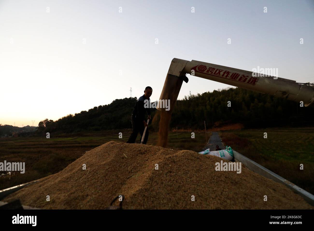 CHENZHOU, CHINA - OCTOBER 13, 2022 - Villagers load a truck with ...