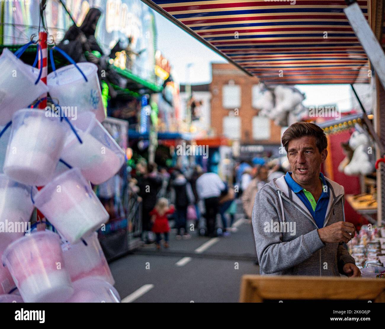 Oct 8th 2022, Tewkesbury Mop Fair, England. A man is buying something ...