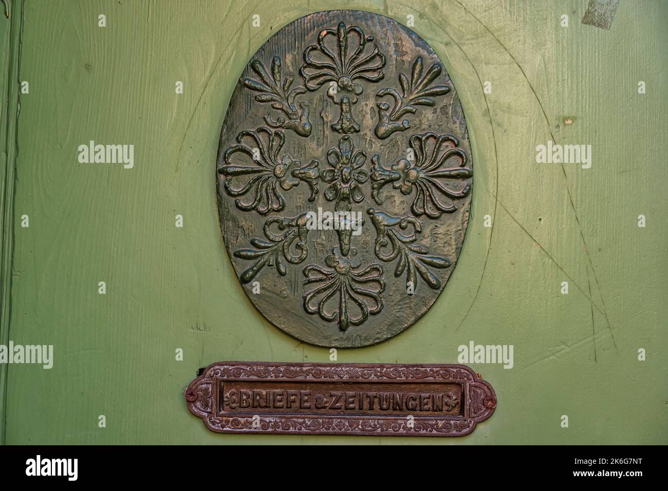 Oval wood carving and letter slot with the inscription "Letters ...