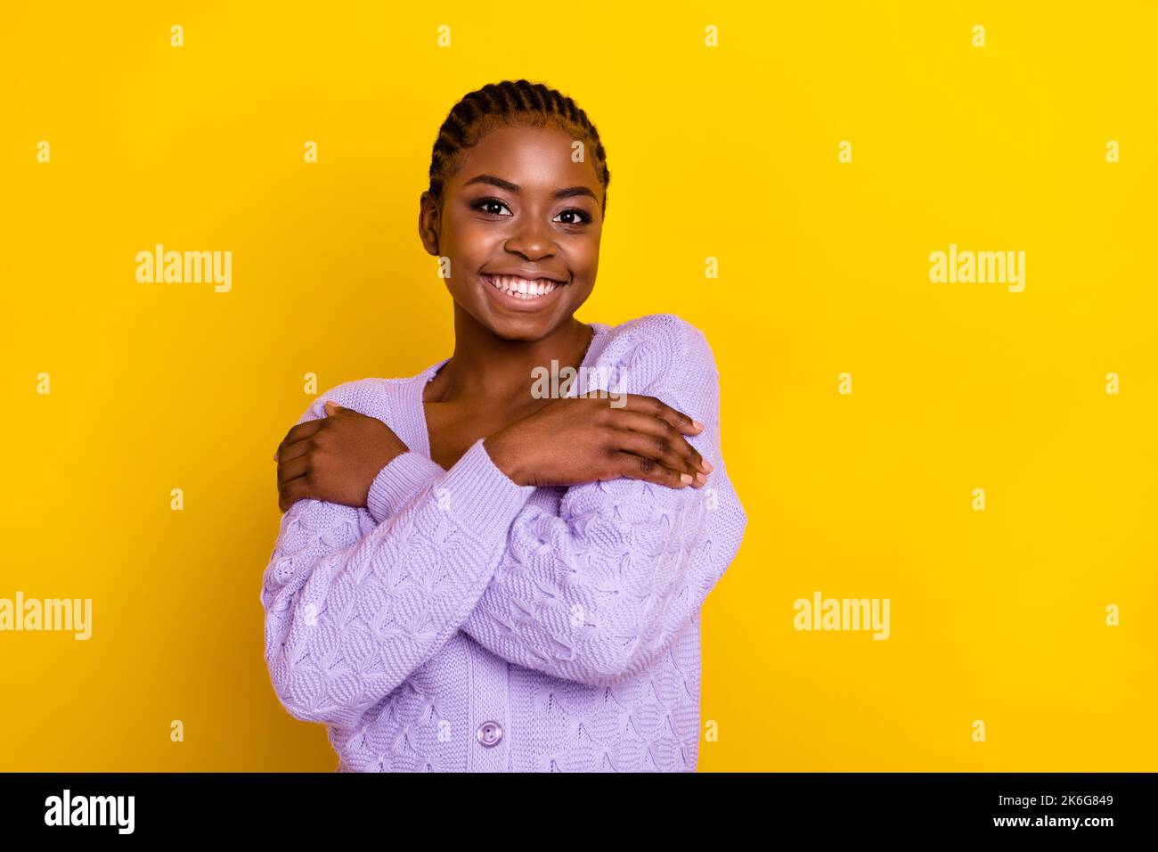 Portrait of adorable peaceful girl arms hug shoulders toothy smile ...