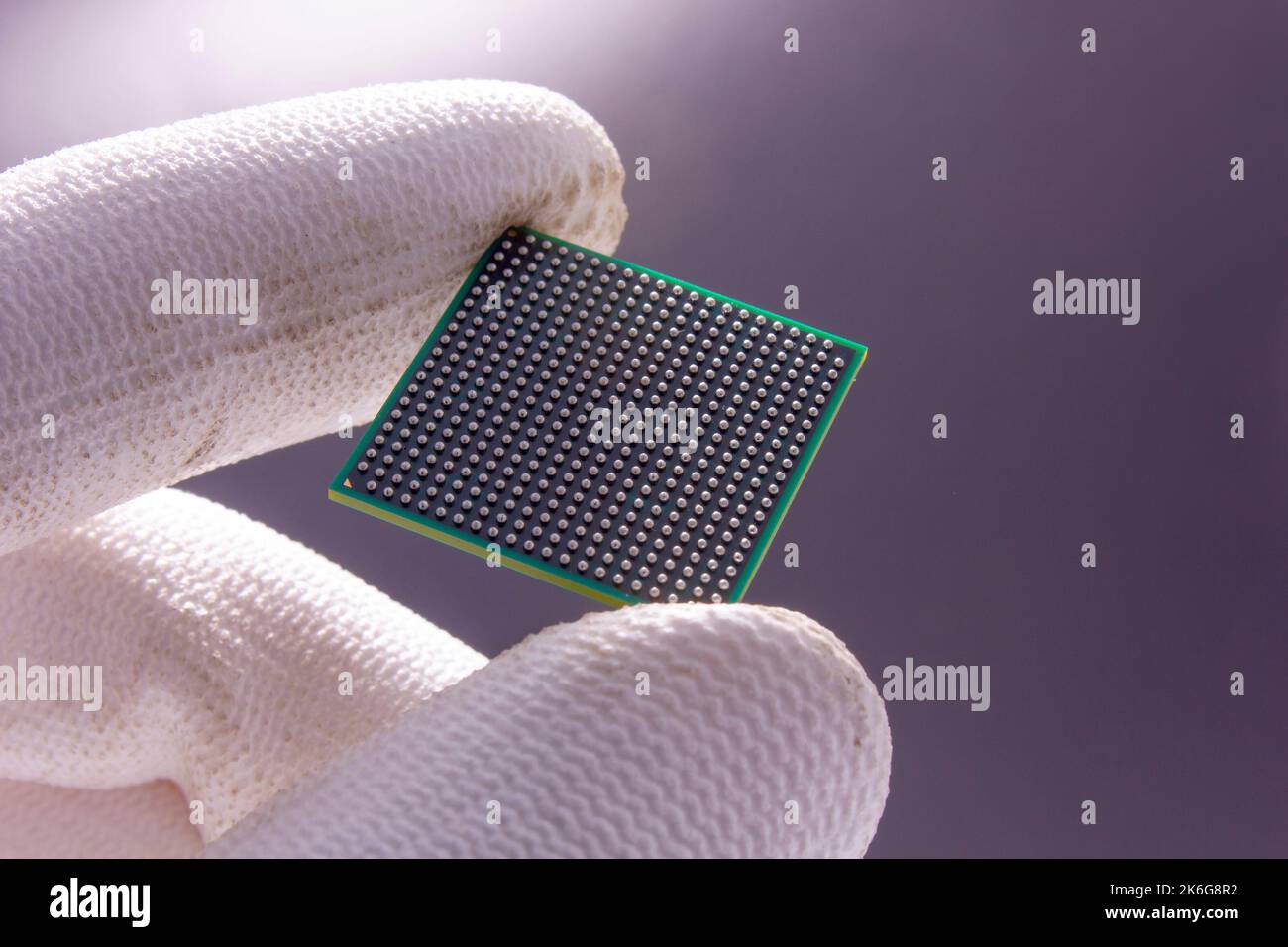 Semiconductor BGA chip in a hand on a gray background Stock Photo - Alamy
