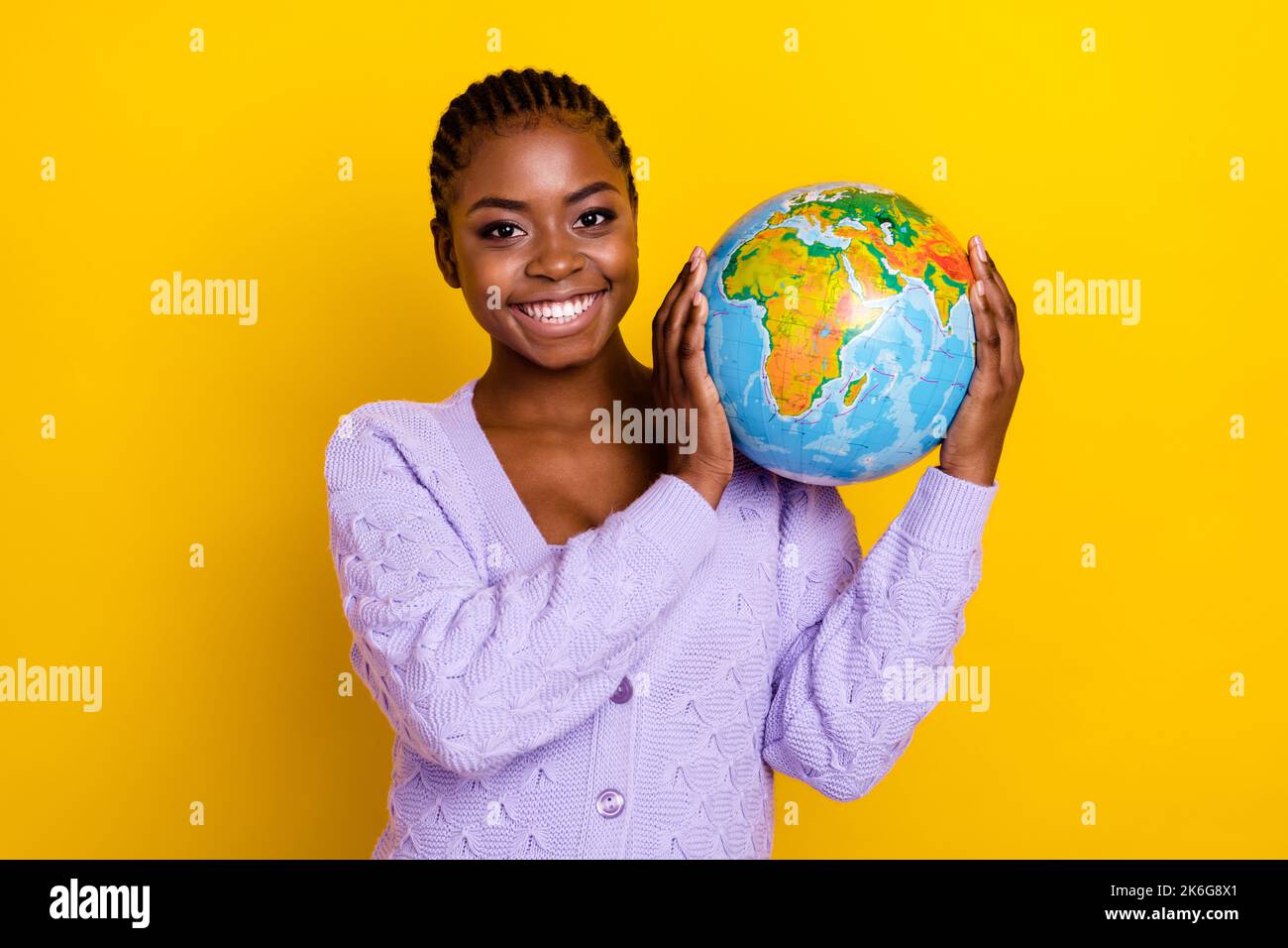 Portrait of nice cheerful girl hands hold globe beaming smile isolated ...