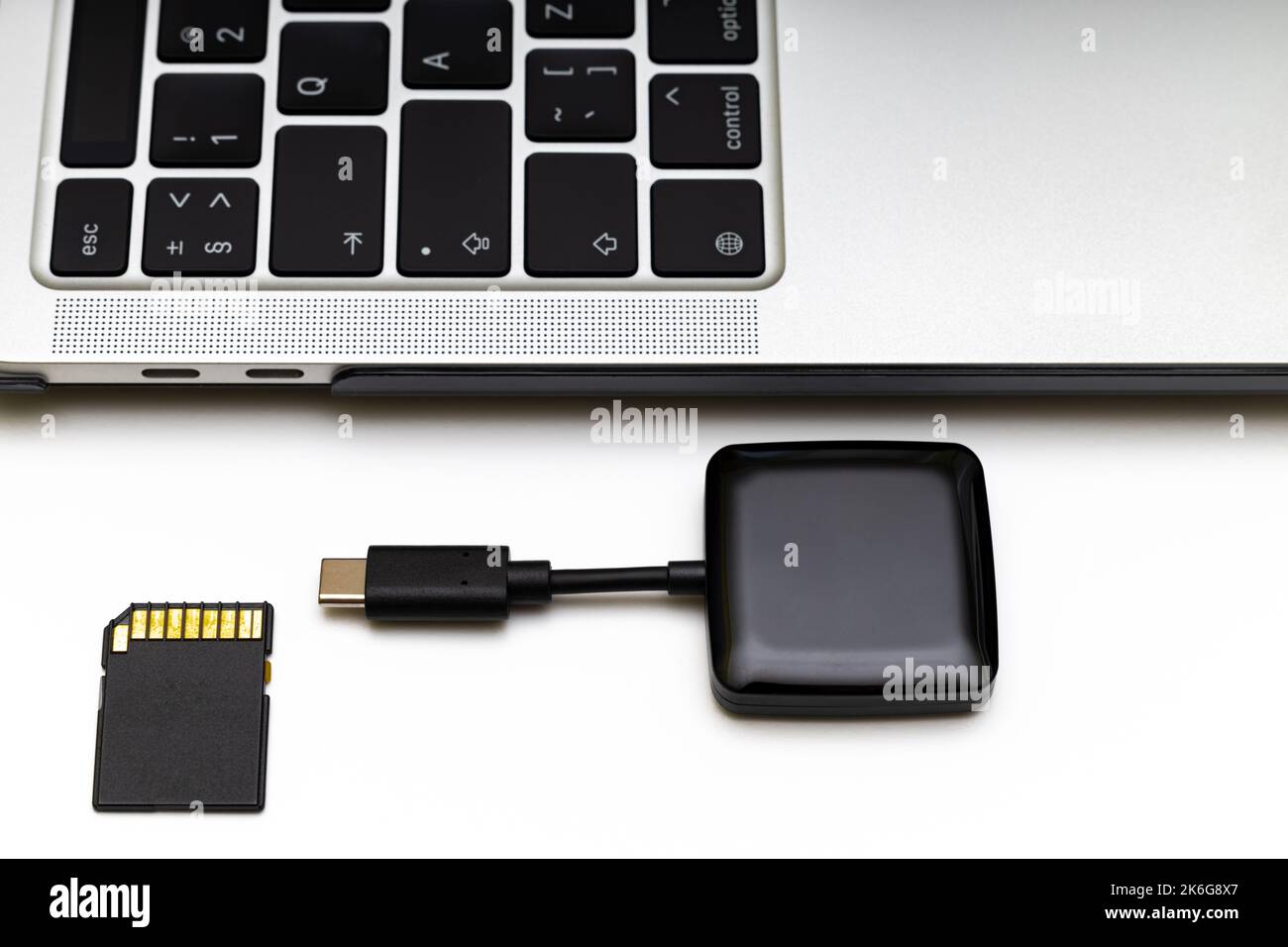 memory card and card reader connected to laptop. High quality photo ...