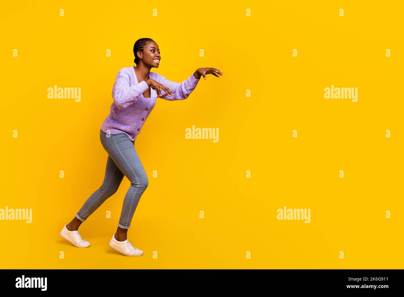 Full body profile portrait of excited crazy girl pretend zombie walk ...