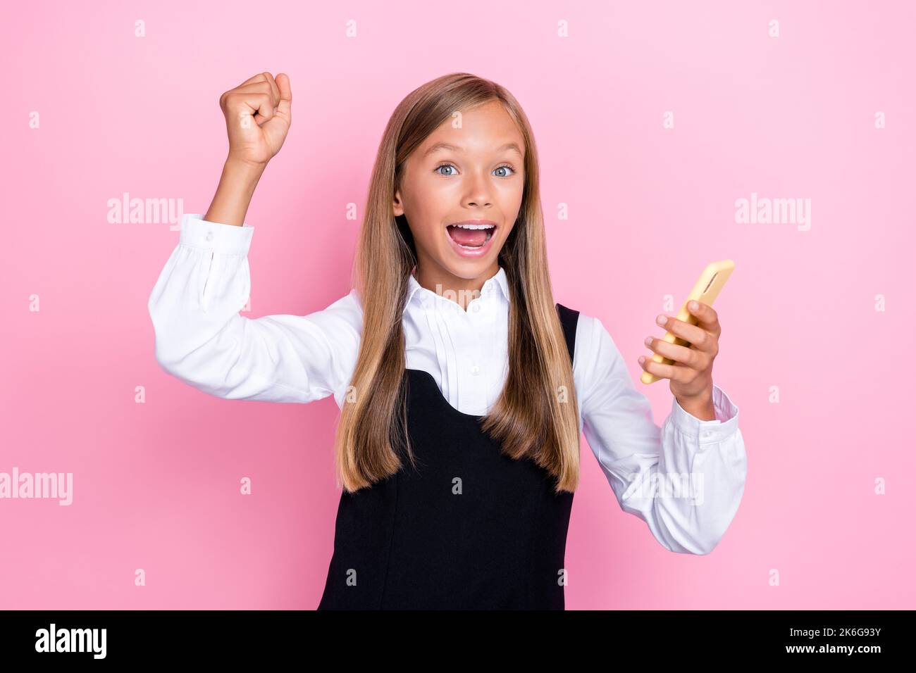 Photo of cheerful girl hold modern device celebrate success achievement ...