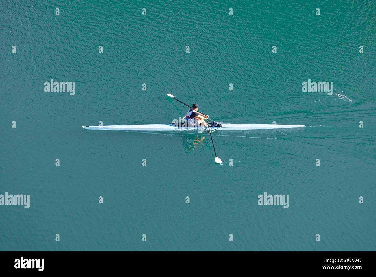athletes training in canoe on the Nervion river in Bilbao city, basque ...