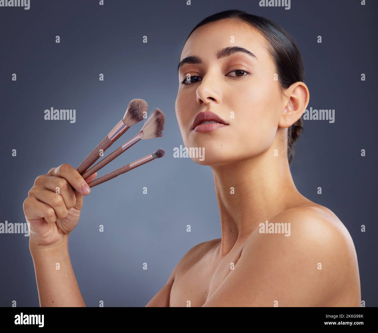 Give a girl the right tools and shell create a masterpiece. Studio shot ...