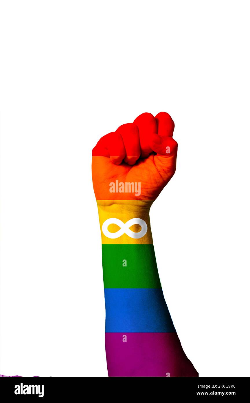 A vertical of rainbow flag with Autistic Pride sign painted on human ...