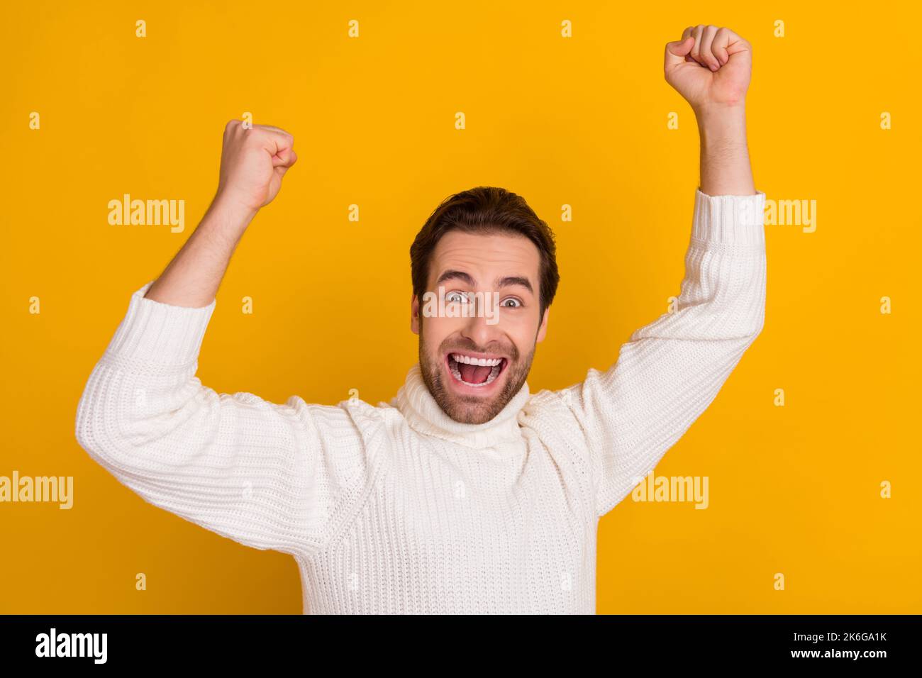 Photo of crazy astonished guy raise hands celebrate goal attainment ...