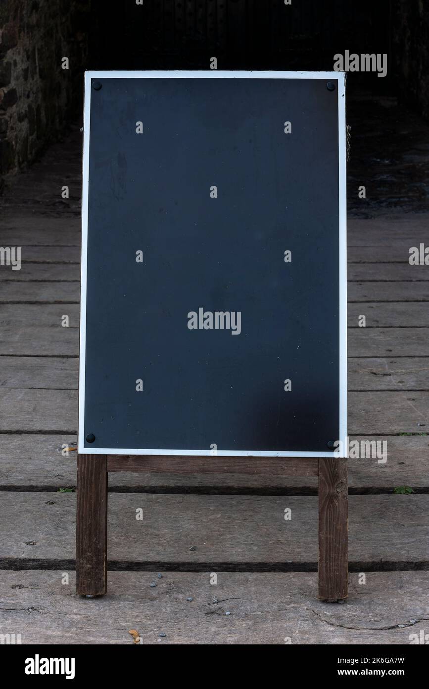 Blank notice board sign on a chalkboard blackboard wooden frame placard ...