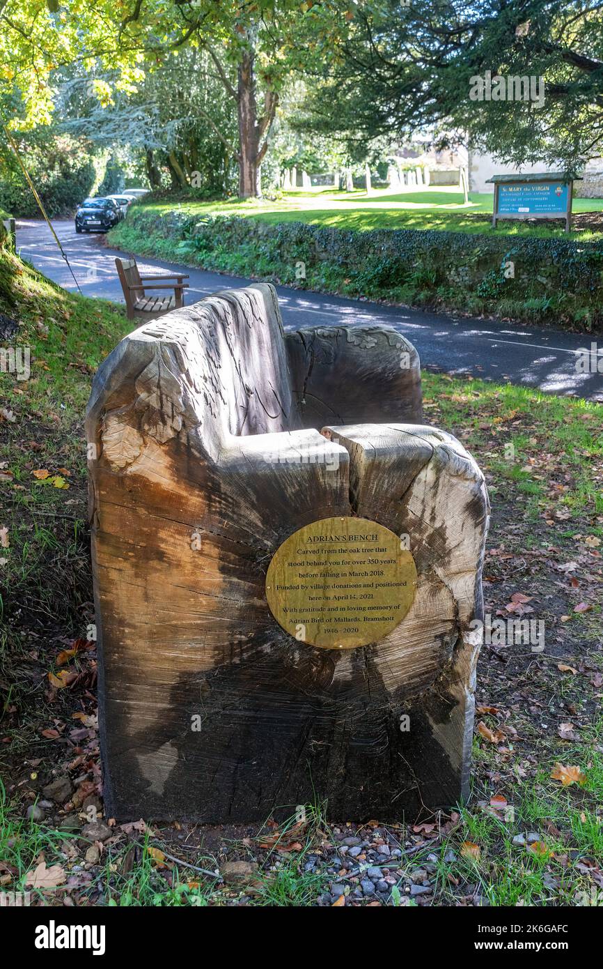 Wooden bench in Bramshott village, Hampshire, UK, carved from the ...