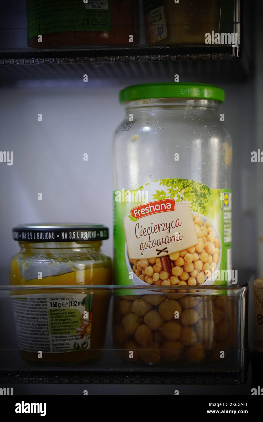 A vertical closeup of the Freshona brand chickpeas in a glass jar ...