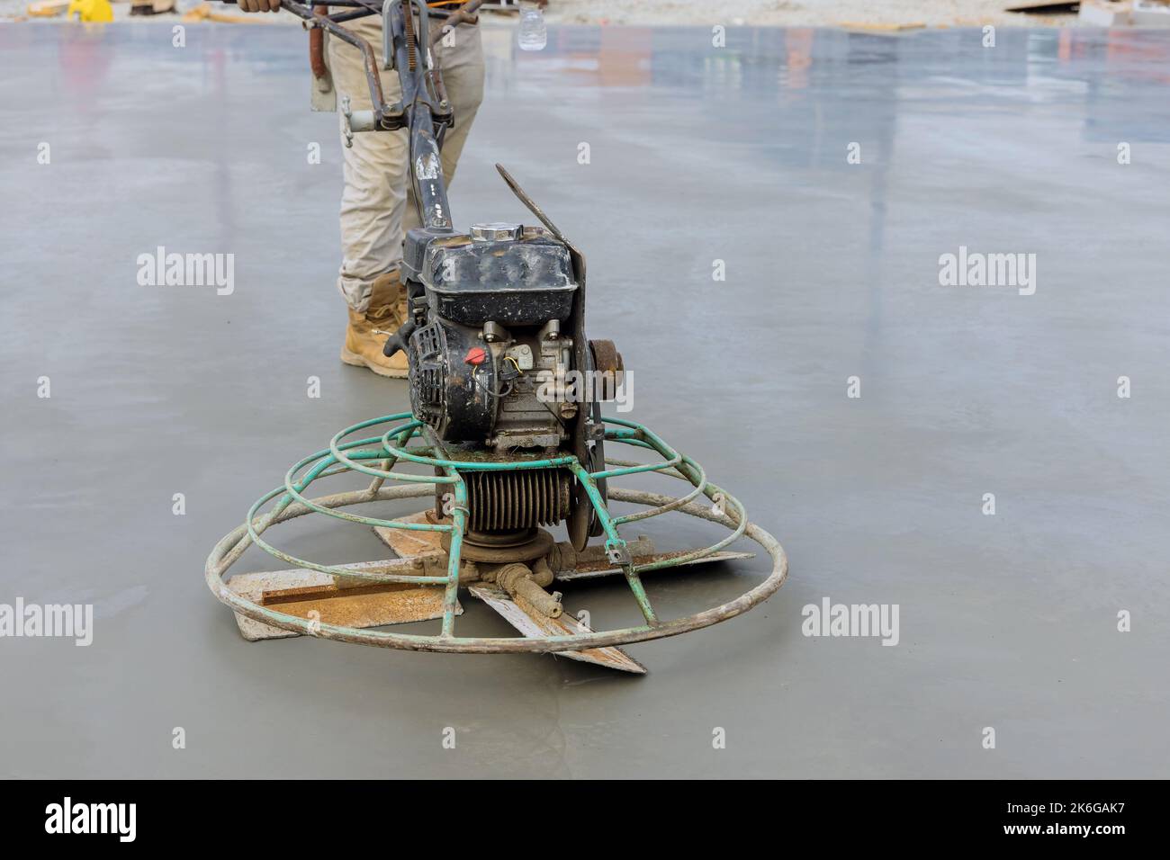 An operation to polish and level cement screed mortar floor on ...