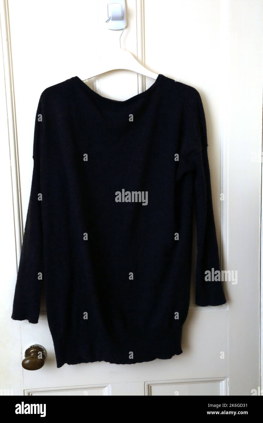 Back of Women's Long Black jumper Stock Photo - Alamy
