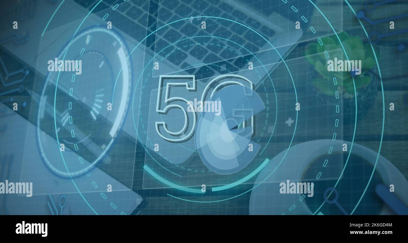 Image of scope scanning with 5g text and data processing over desk with laptop Stock Photo - Alamy