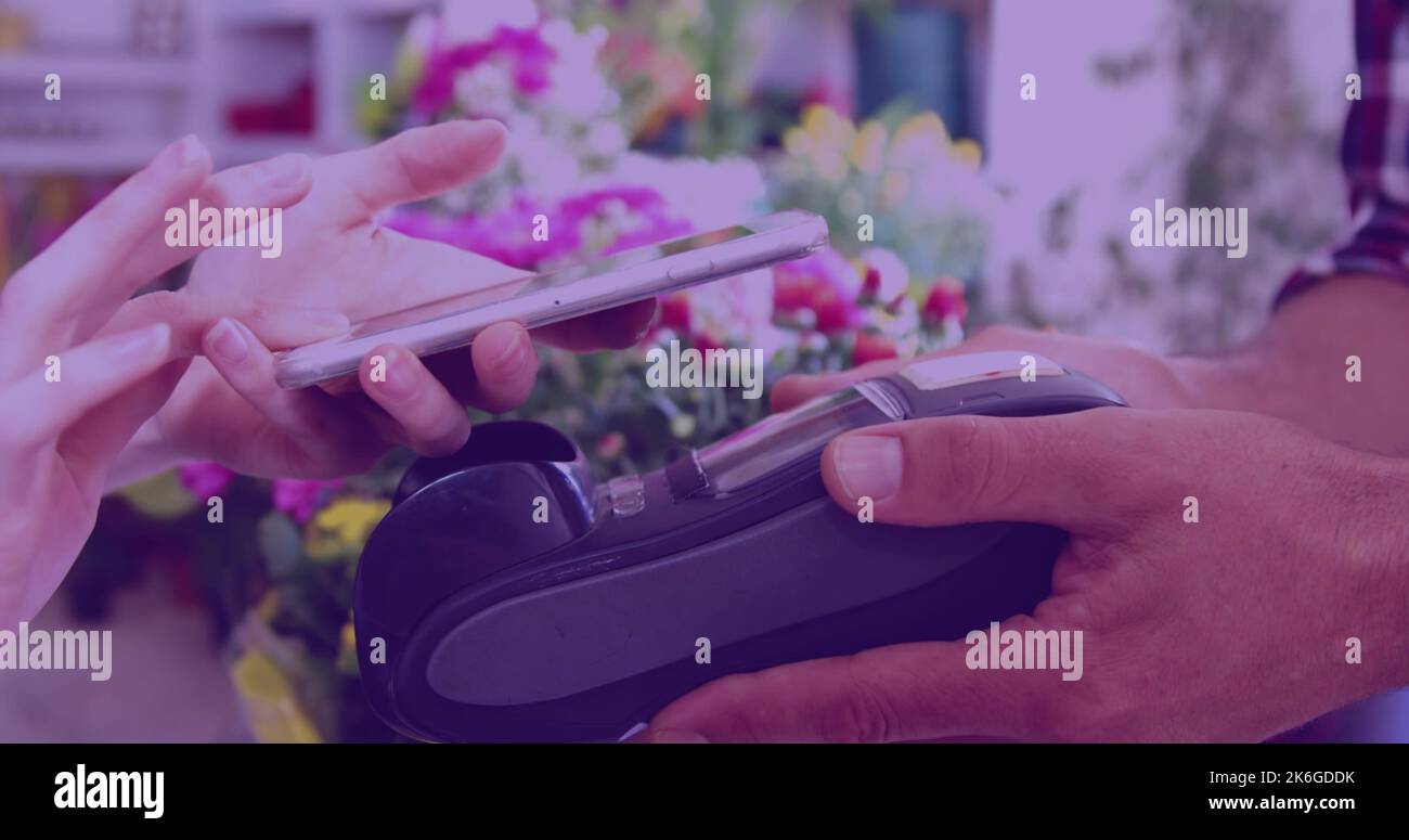 Composition of hands paying with smartphone Stock Photo - Alamy