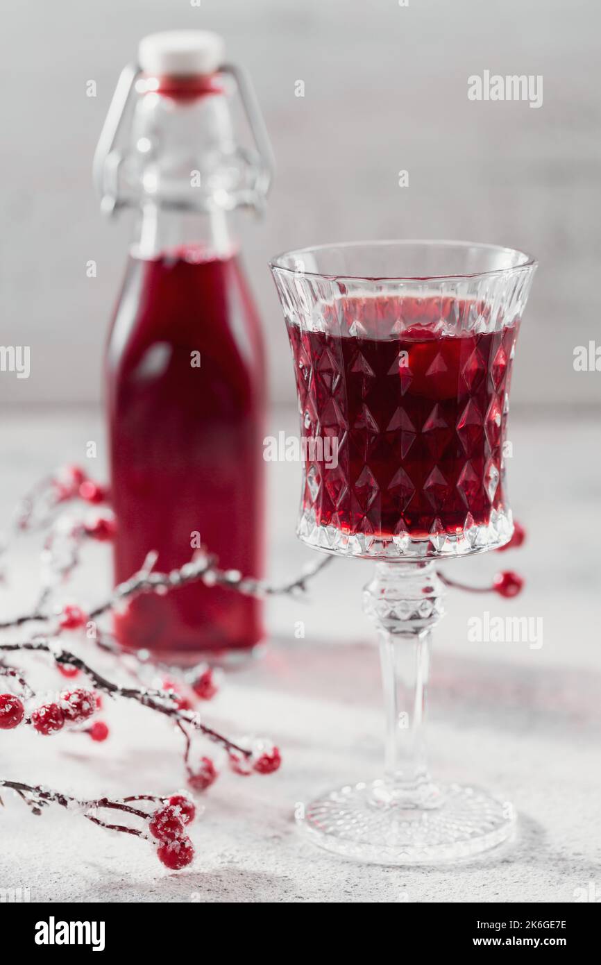 Homemade infused vodka, tincture or liqueur of red cherry Stock Photo ...