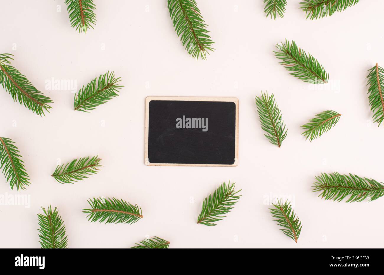 Christmas holiday background, chalkboard with fir branches, winter ...