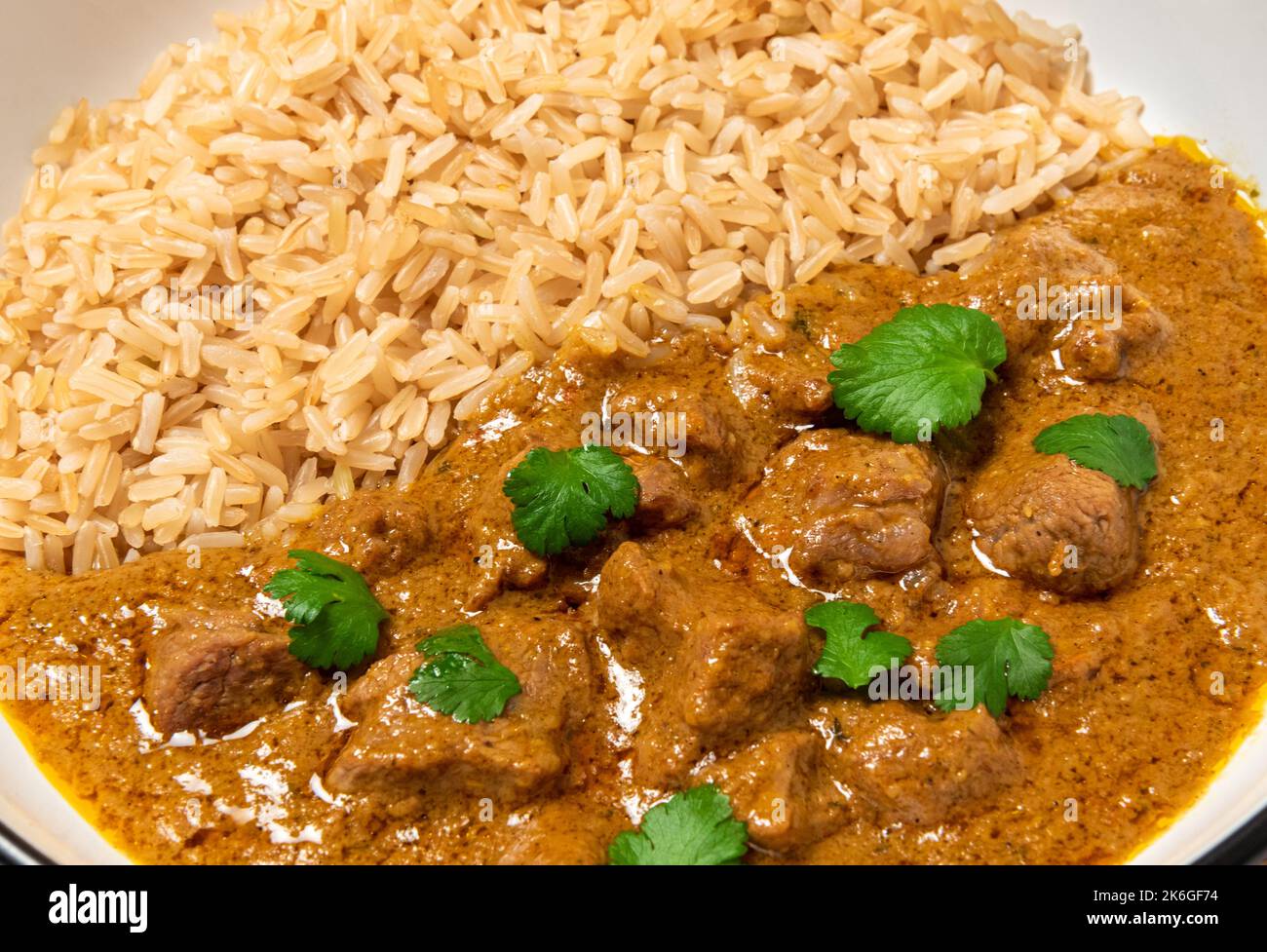 Lamb korma and rice Stock Photo - Alamy