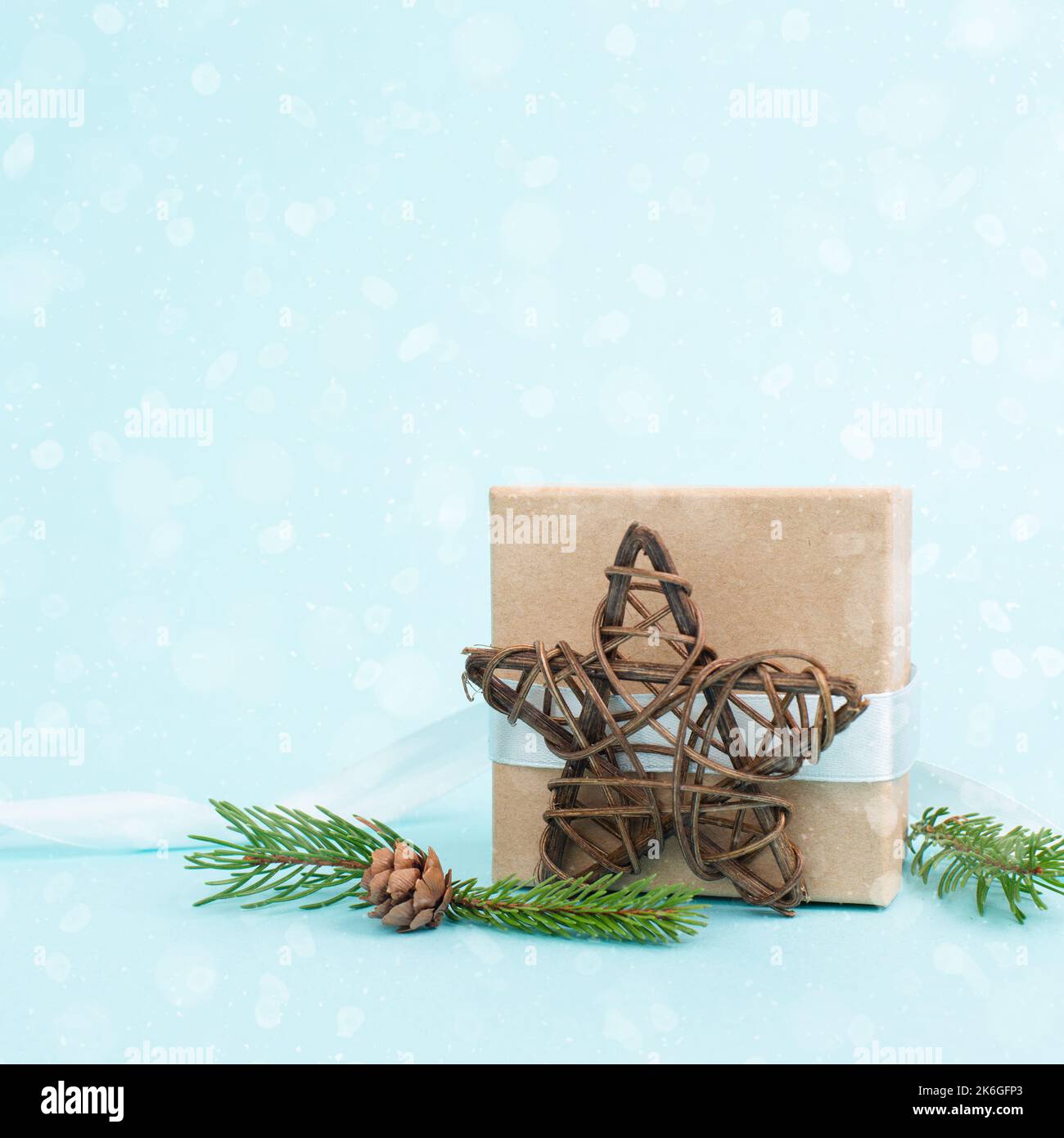 Christmas holiday greeting card with little gift box, pine cones and ...