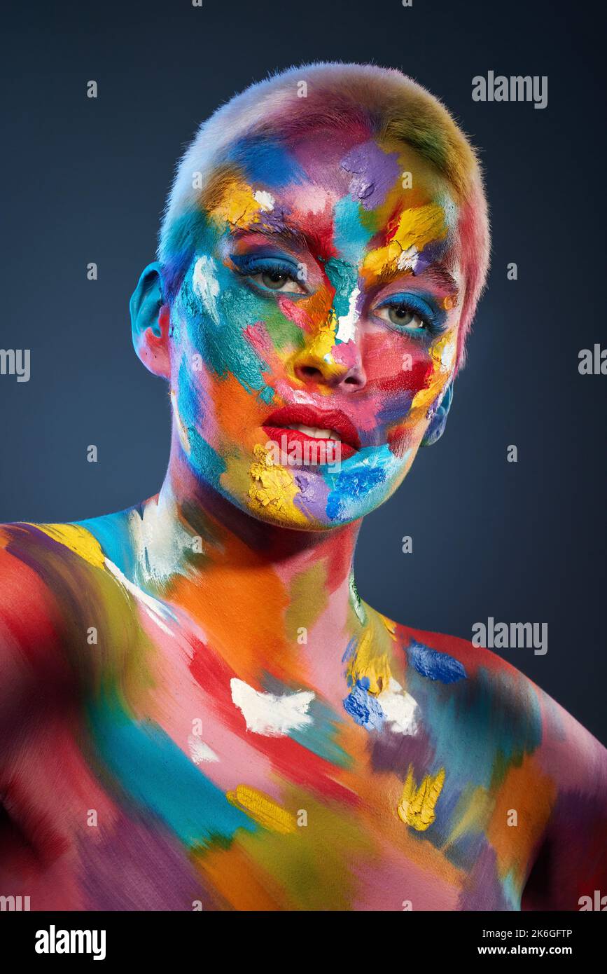 Artists use colour to express themselves. Studio shot of a young woman ...
