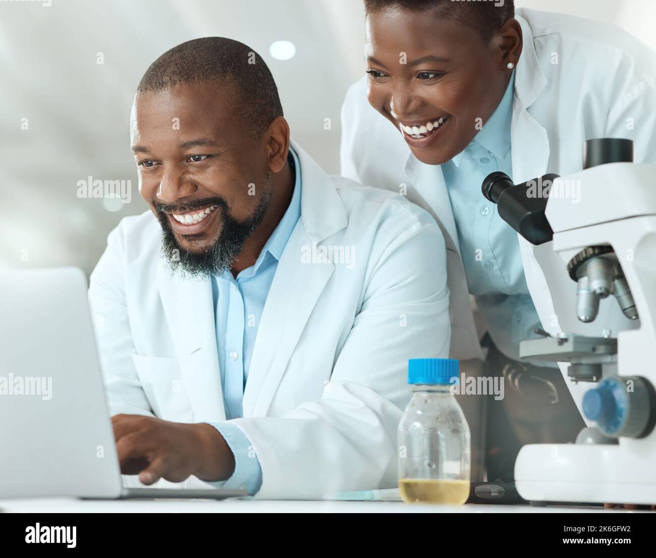 Take a look at these results. two scientists using a laptop in a ...