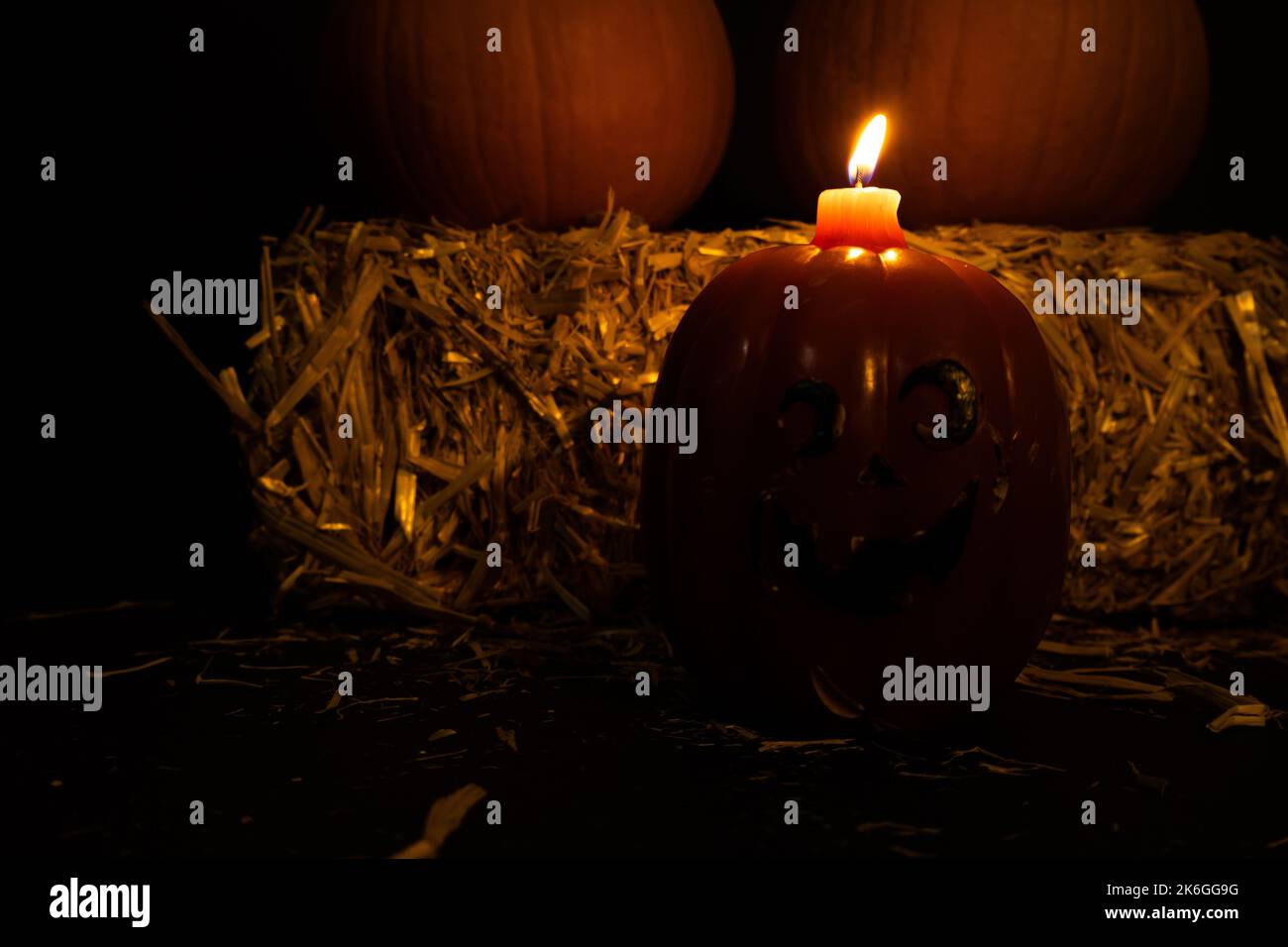 A closeup of a lit Jack-o'-lantern in the barn Stock Photo - Alamy