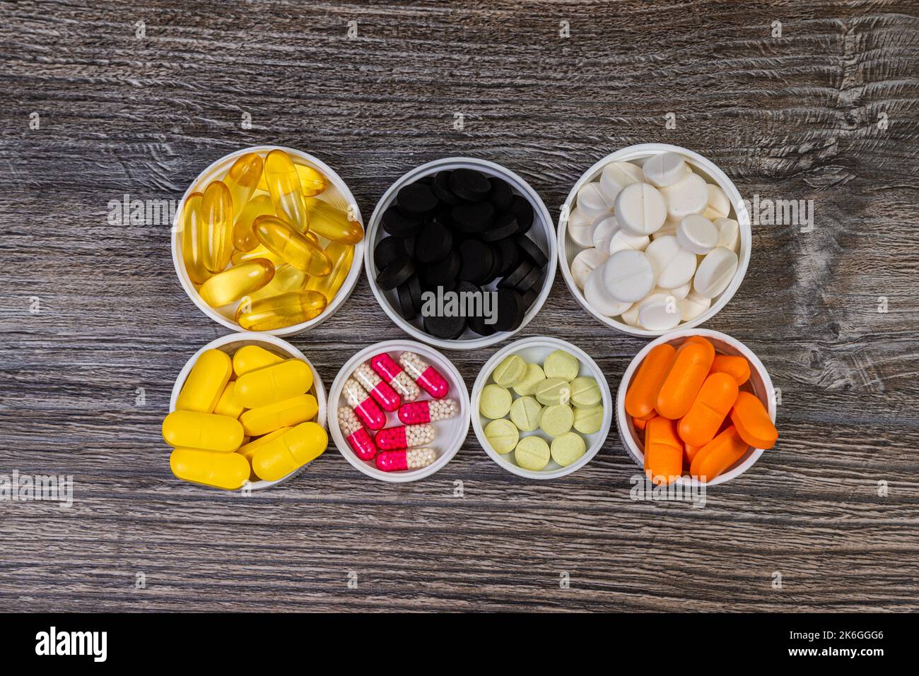 Medical colorful pills on isolated on wooden background Medical ...