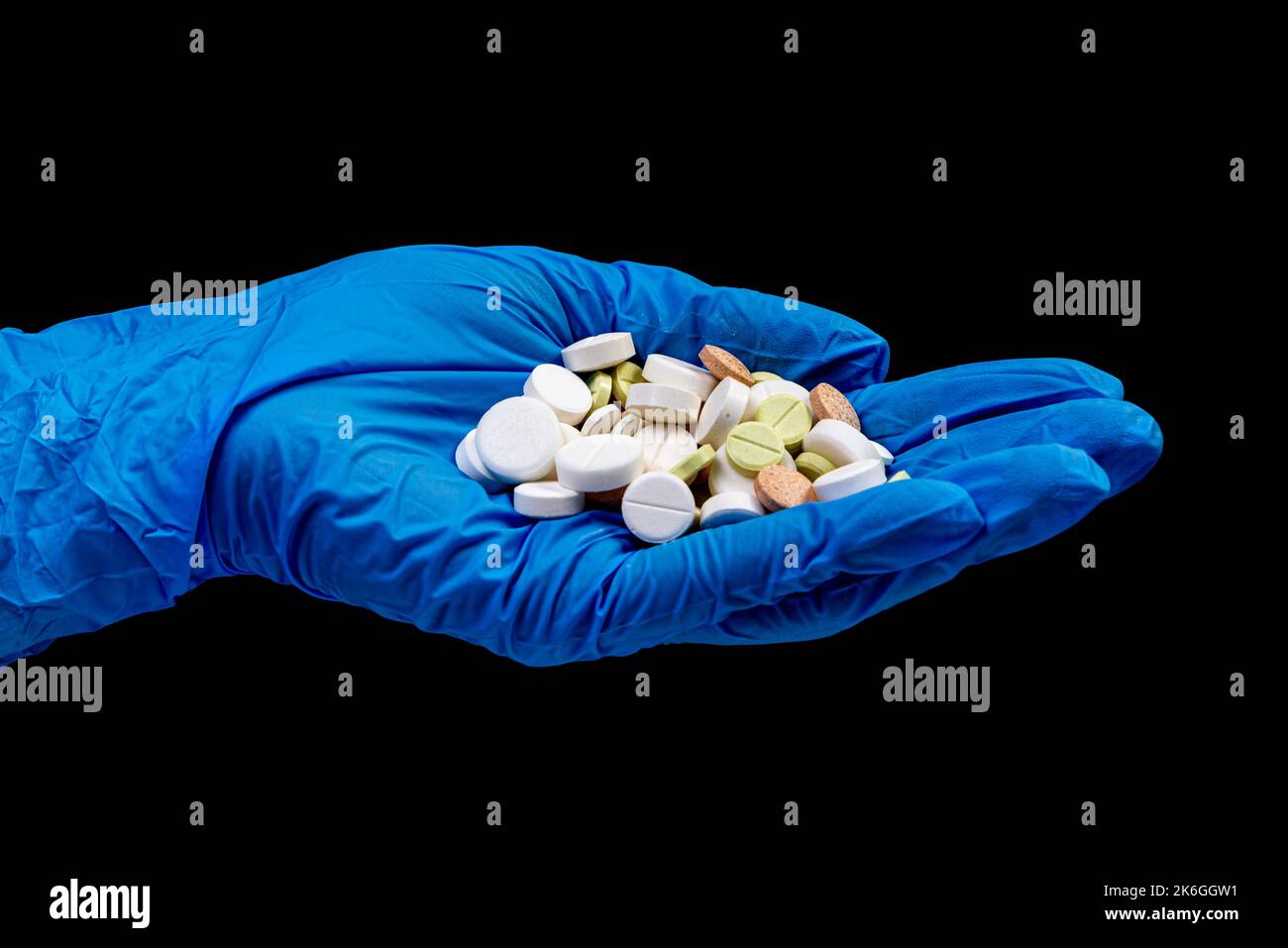 Medical pills in blister on isolated black background with reflection ...