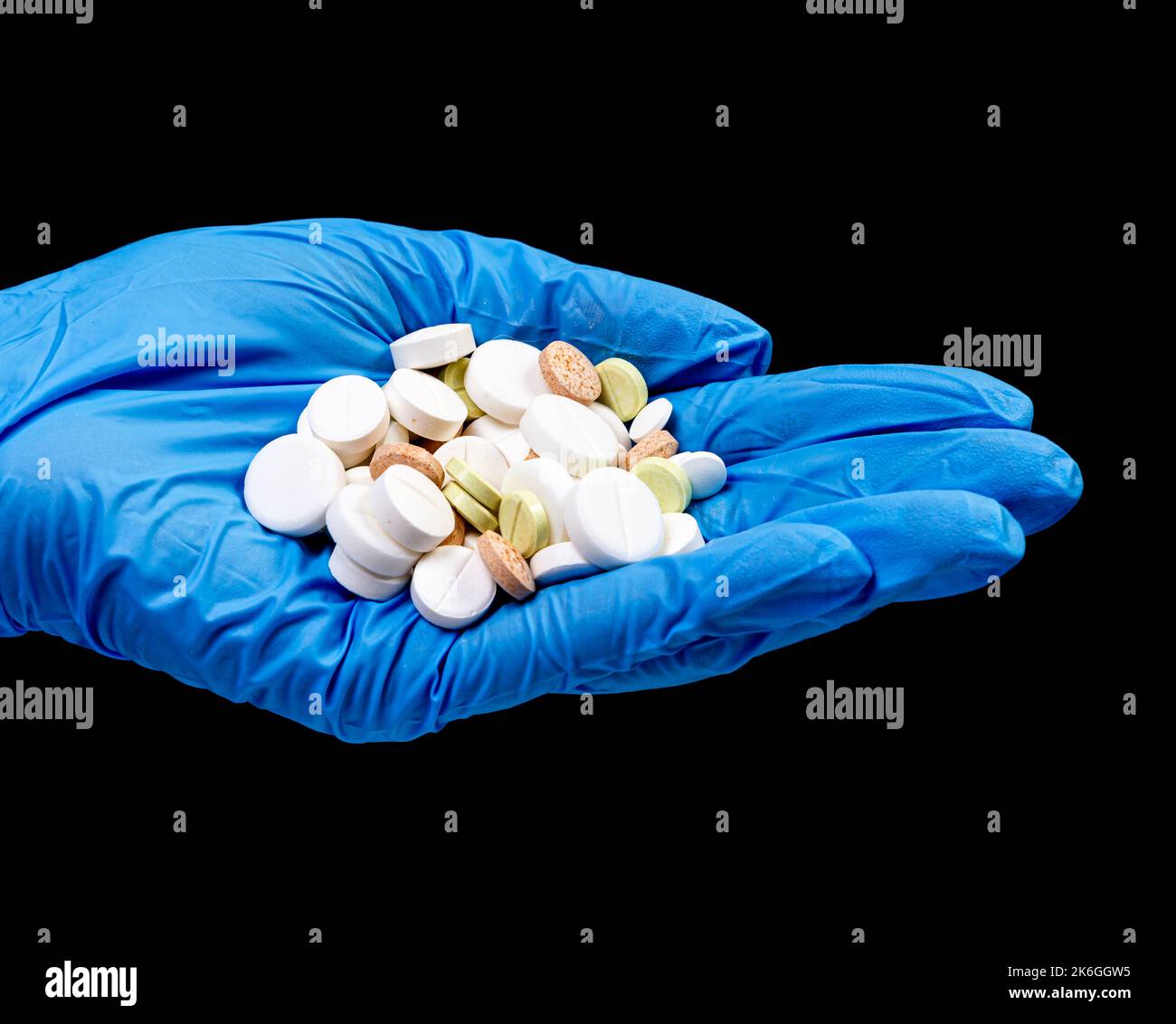 Medical pills in blister on isolated black background with reflection ...