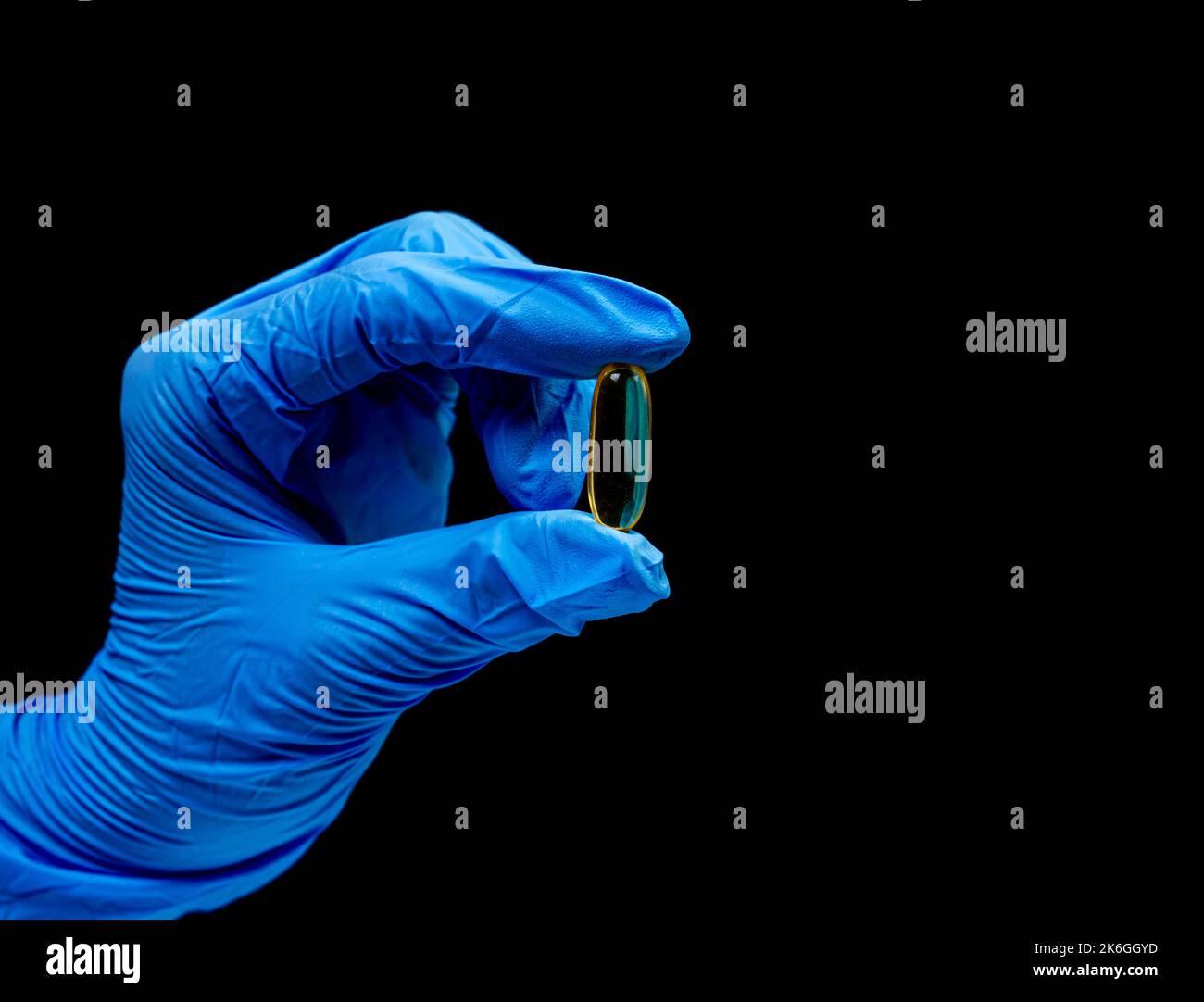 Medical pills in blister on isolated black background with reflection ...