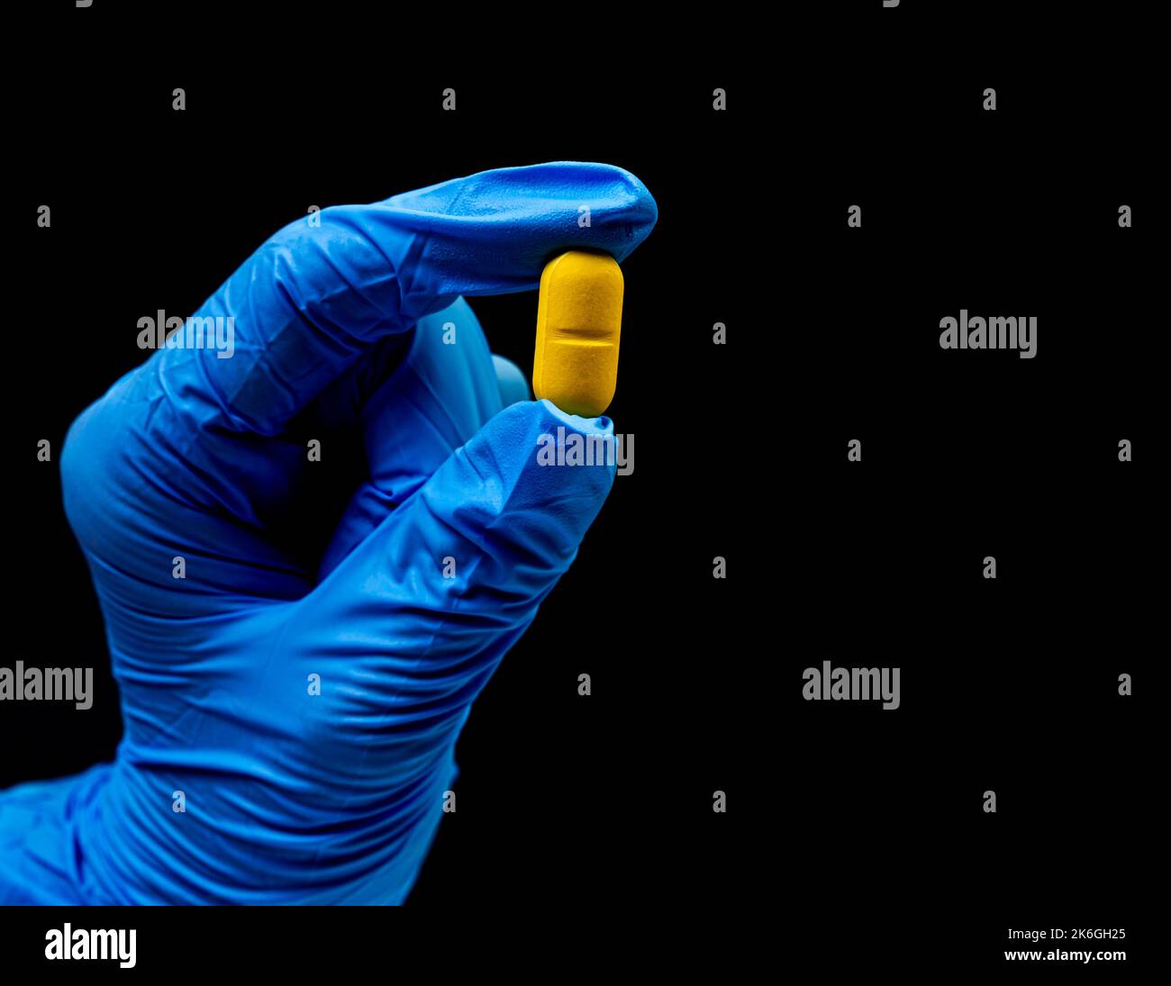 Medical pills in blister on isolated black background with reflection ...