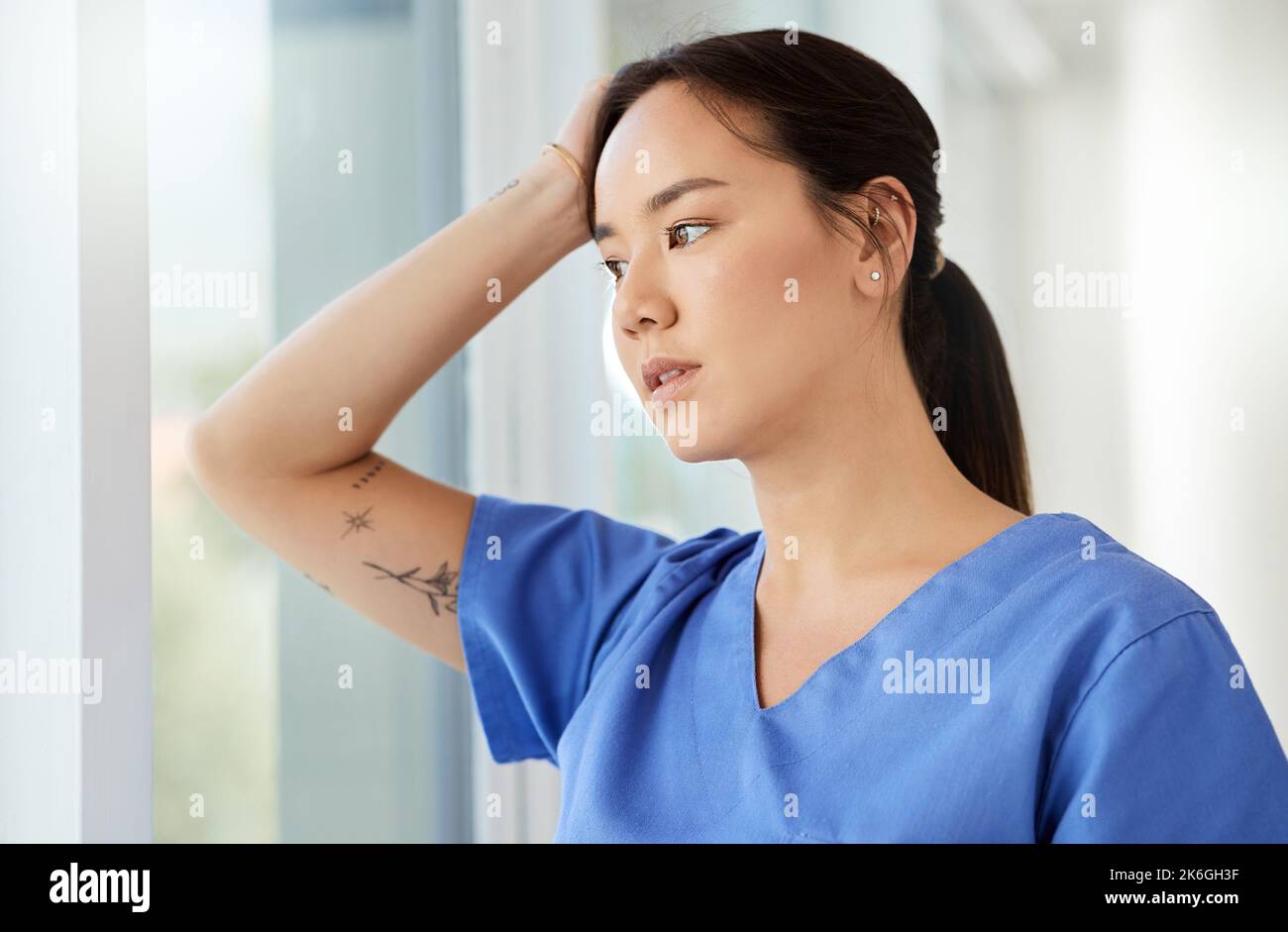 Nurses are the closest thing to angels. a female nurse looking stressed ...