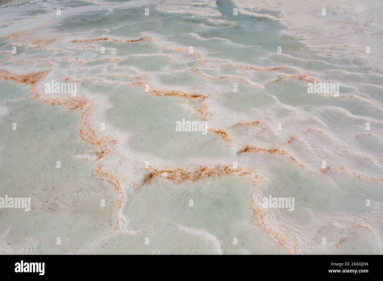 Natural travertine pools and terraces in Pamukkale. White travertine ...