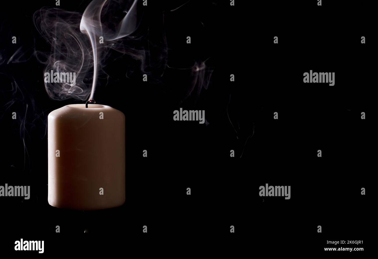 Wax candle off with dark background Stock Photo - Alamy