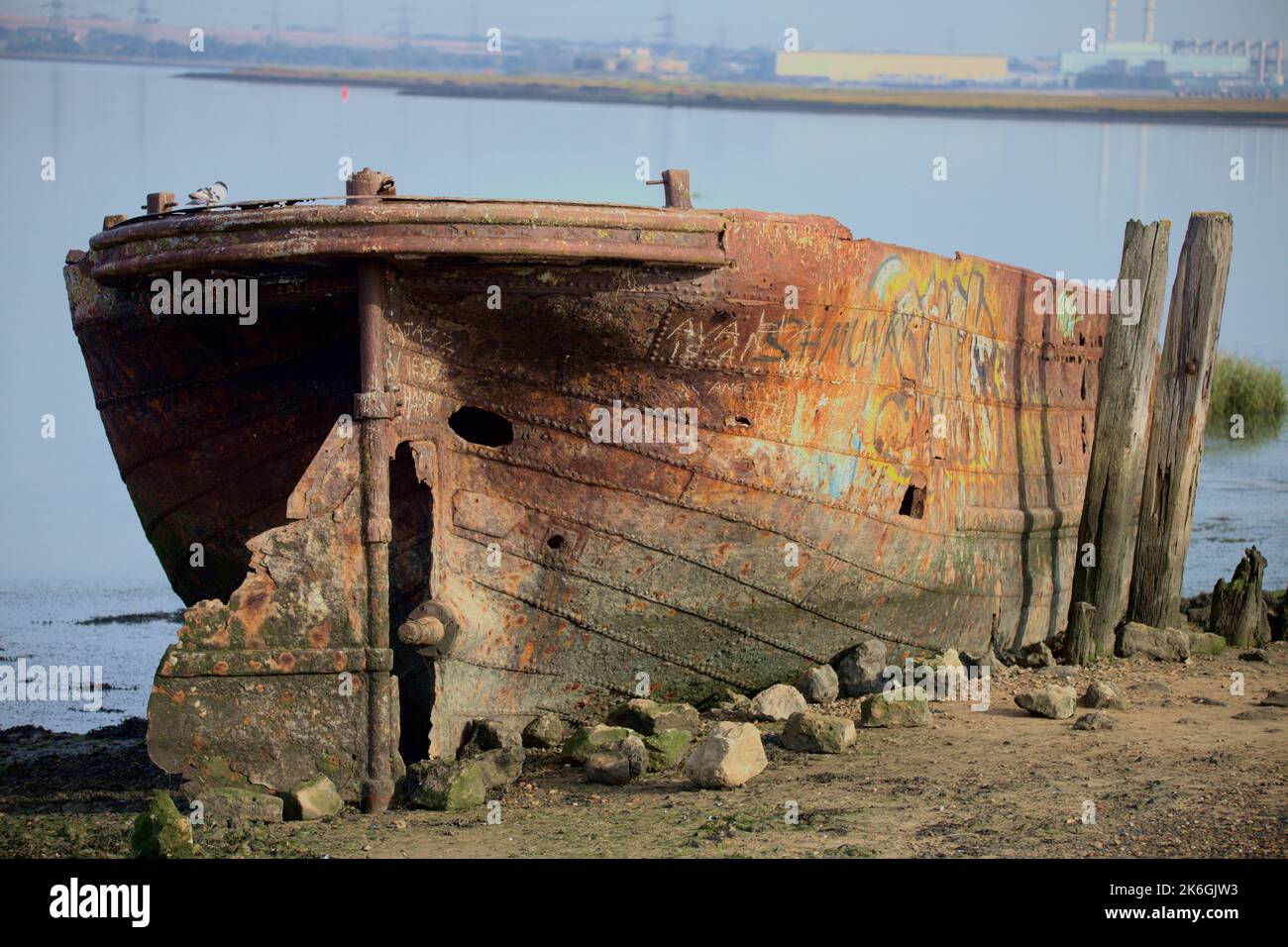 Rusting abandoned old boat wrecks at riverside park on the mud flats ...