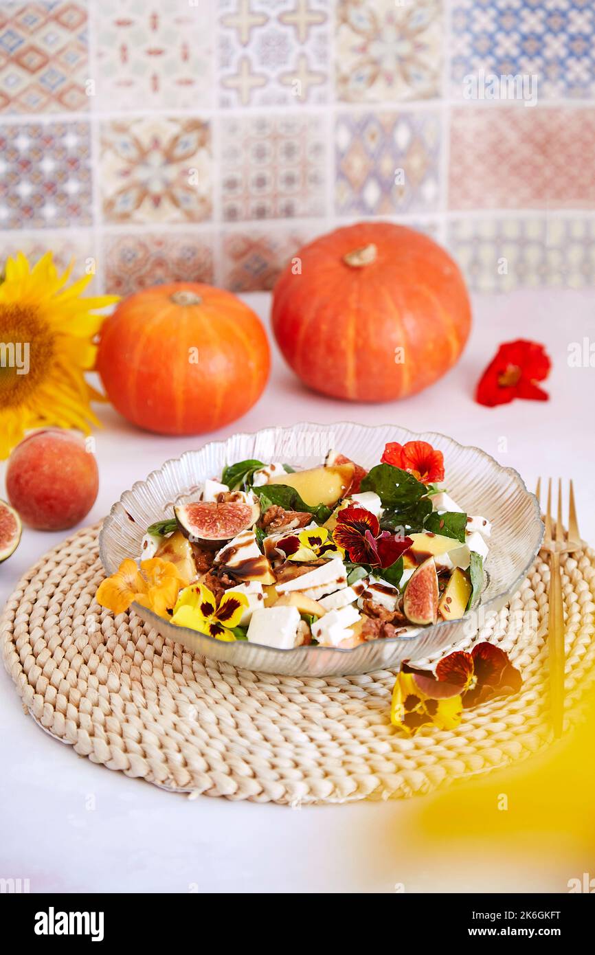 Aesthetic lunch - vegetarian salad with feta, edible flowers, figs ...