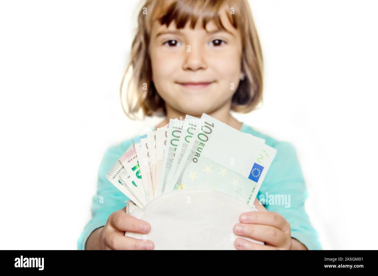 The child is holding money in his hands. Selective focus Stock Photo ...