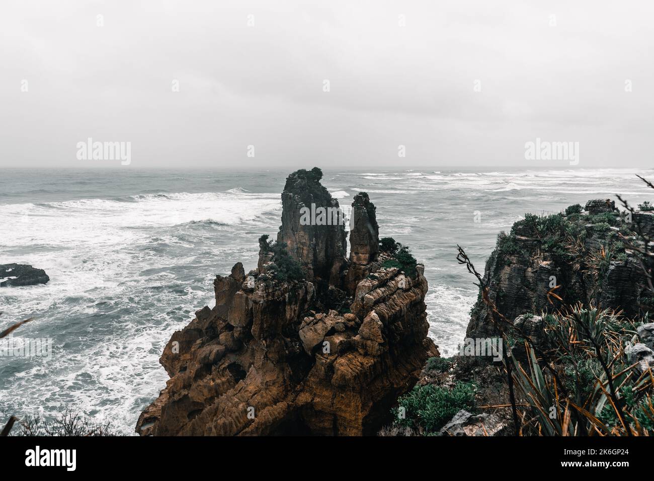 big rock of different colors with strange shapes in an ocean with very ...
