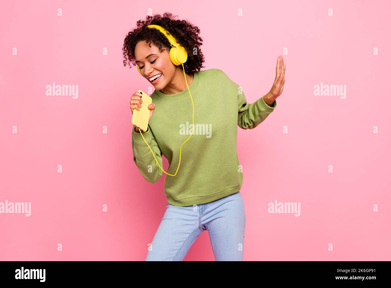 Photo of young cheerful girl have fun voice mic mobile melody listen ...