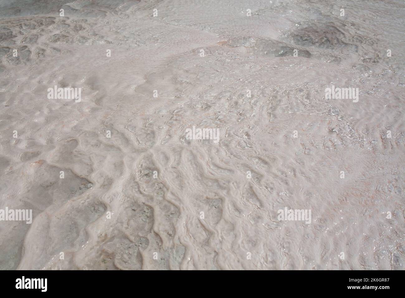 Limestone floor with water in Pamukkale calcium travertine in Turkey ...