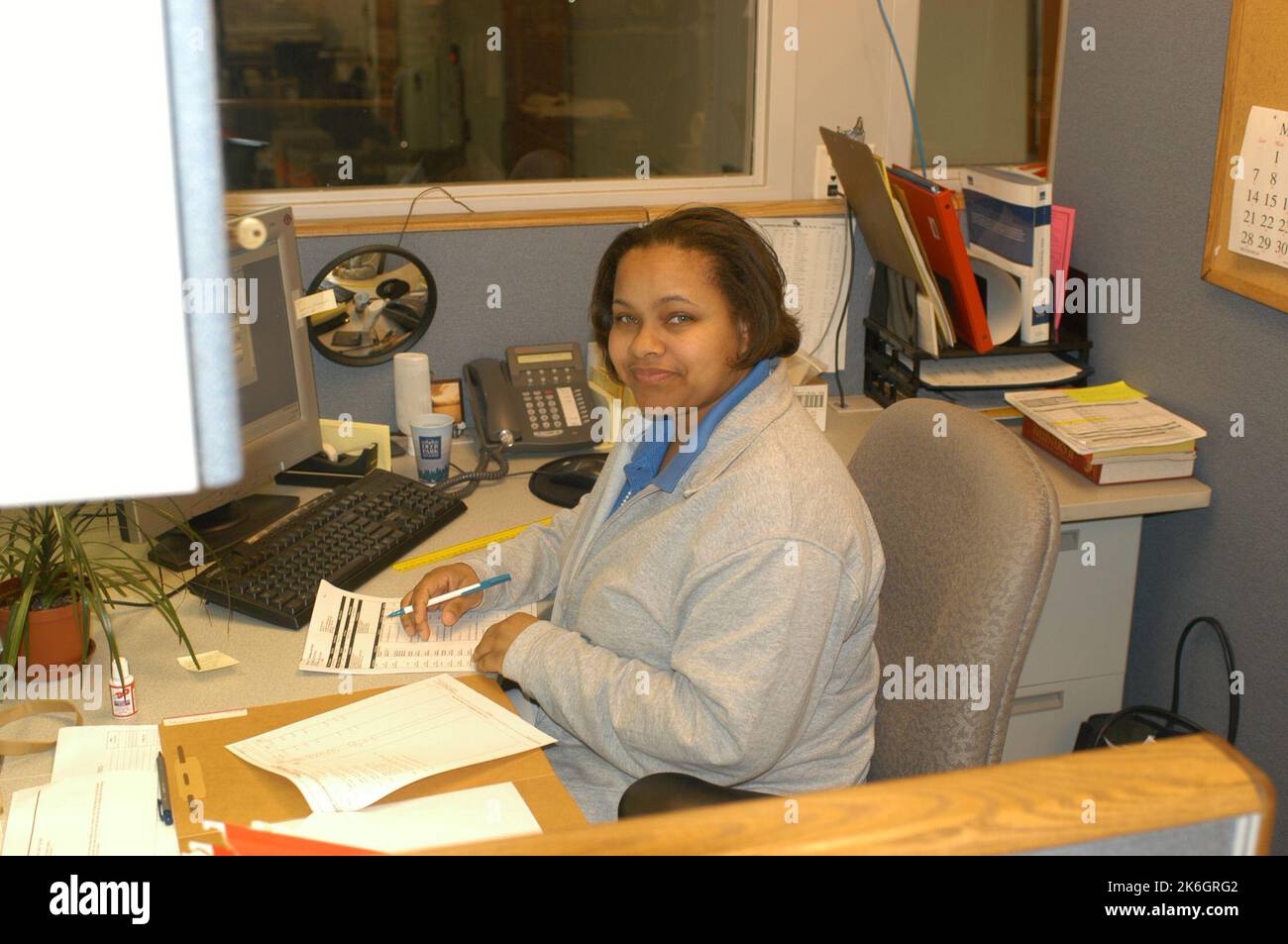 Views of Bureau of Administration staff in assorted work settings, for ...