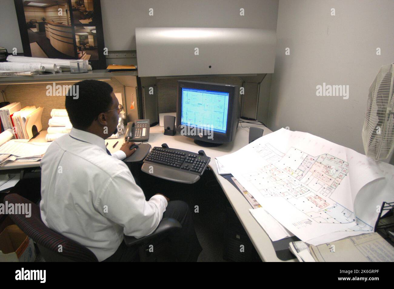 Views of Bureau of Administration staff in assorted work settings, for ...