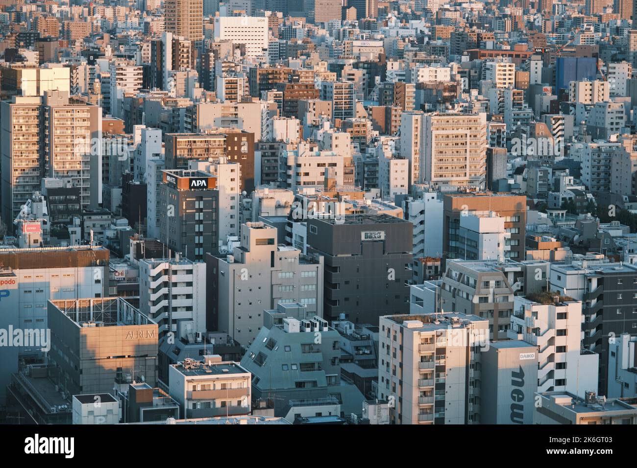 An arial shot of the high-rise buildings in Tokyo, Japan on a sunny day ...