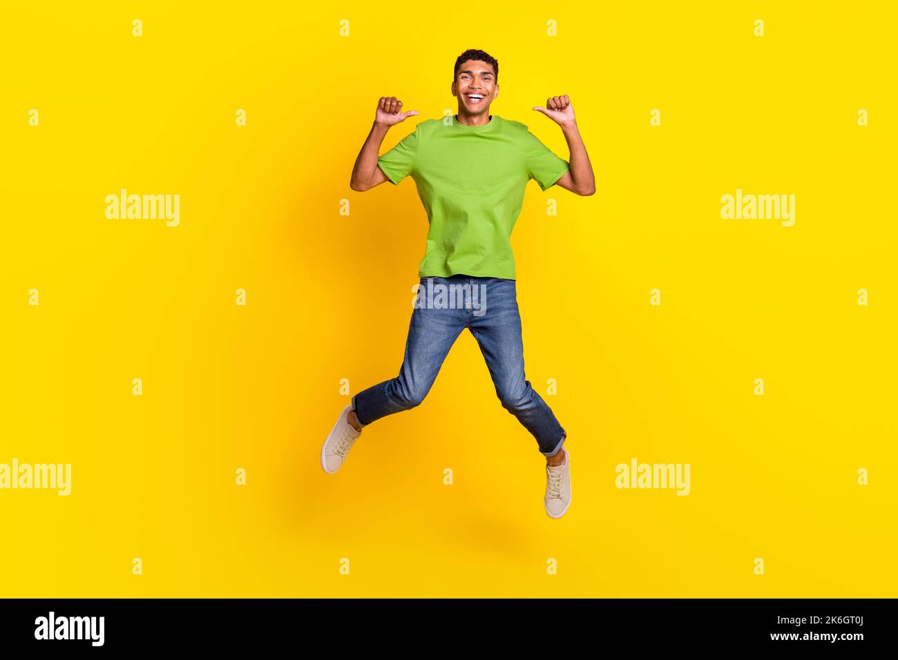 Full size photo of overjoyed excited man jumping point fingers self ...