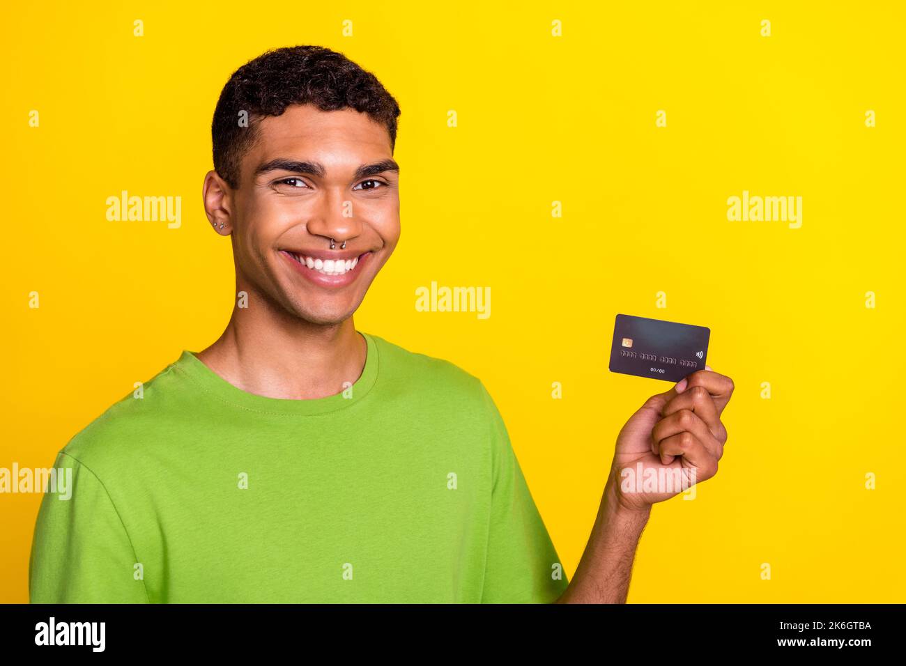 Closeup photo of young attractive handsome smiling positive guy hold ...